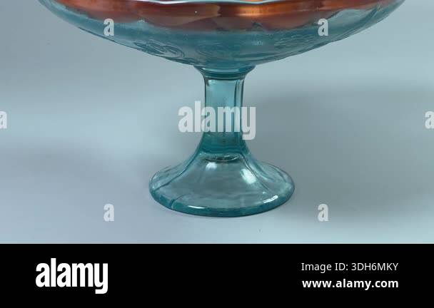 Persimmon fruits Fuyu variety in vintage glass fruit vase Stock Video ...