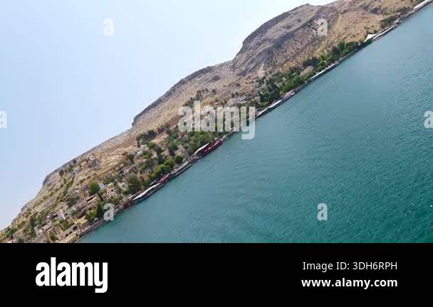 People live in stone buildings by ancient Turkish river Stock Video ...