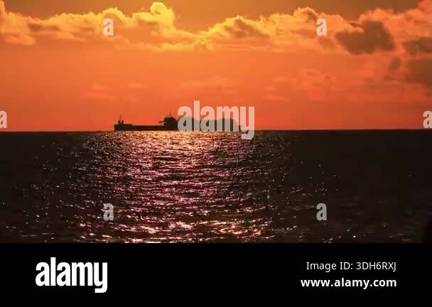 Cargo ship silhouette distant ocean sunset Bogliasco Italy Stock Video ...