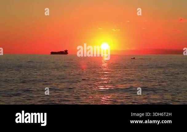 Cargo ship silhouette distant ocean sunset Bogliasco Italy Stock Video ...