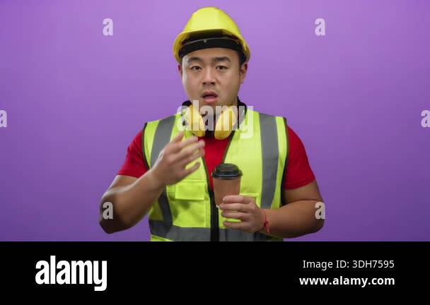Worker yawning holding coffee wearing helmet and vest against isolated ...