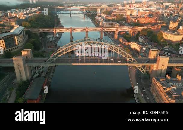Drone flies over the River Tyne towards the Tyne and Swing Bridges on a ...
