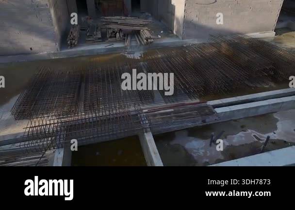 A modern construction project taking shape in a peaceful coastal town ...