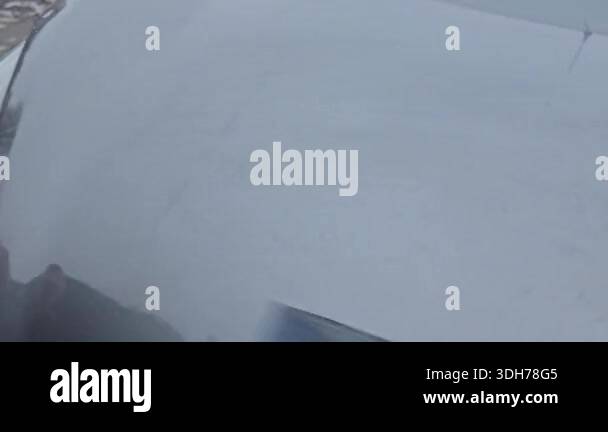 wipe the trunk of a car with a rag man washes a car window. High ...