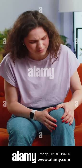 Young woman suffer from painful severe knee joint ache, leg muscles ...