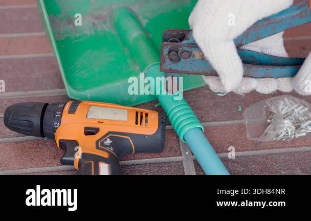 Close-up hand of man use rivet gun or rivet pliers to repair the ...