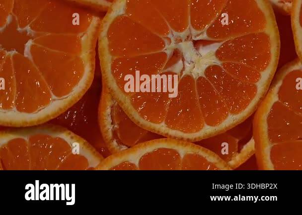 Sliced mandarin orange rotation, satisfying visual, top view Stock ...