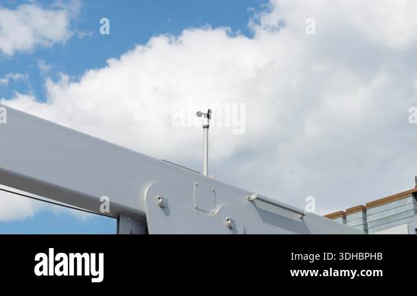 Wind speed sensor (anemometer) spinning fast. The measuring instrument ...