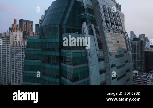 Aerial revealing shot of the KPI Tower, a modern glass skyscraper ...