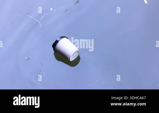 Plastic cup drifting in water near floating market Stock Video Footage ...