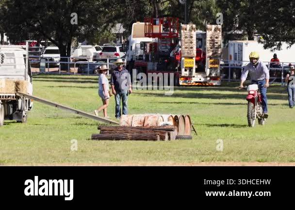 Competitors in a wood chopping and sawing relay Stock Video Footage - Alamy