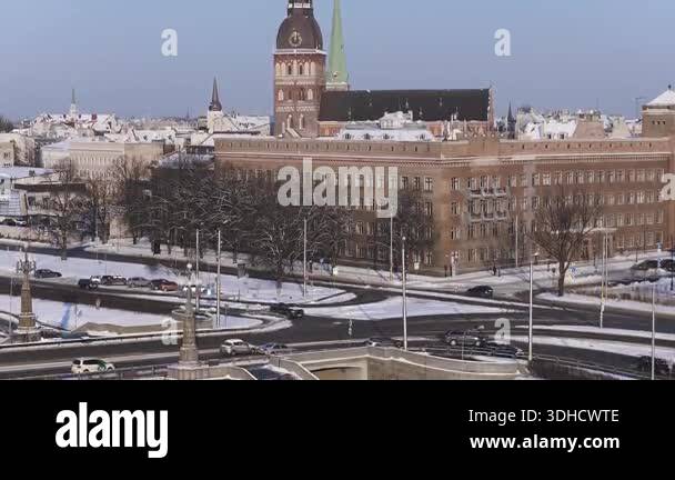 Aerial view shows Riga Cathedral clock tower and green spire above Old ...