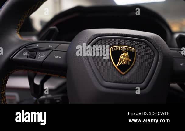 Slow pans show the Lamborghini Urus Performante steering wheel, gold ...