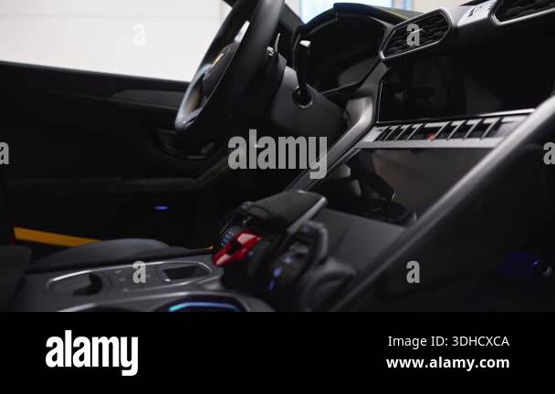 Close up of the driver cockpit shows crest on wheel, hex vents, glossy ...