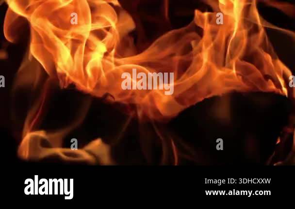 Warm glowing fire flames close-up. Cozy fireplace atmosphere background ...