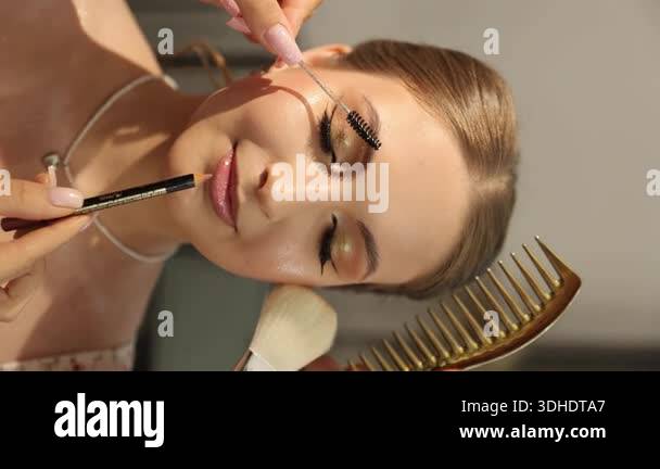Professional makeup artist team using various tools to prepare a ...