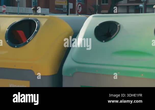 Child recycling glass bottle in outdoor recycling bin Stock Video ...