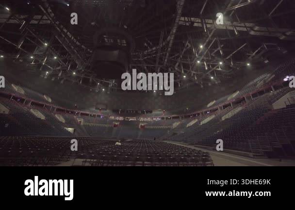 Ceiling lights scattered across massive concert arena. Spotlights ...