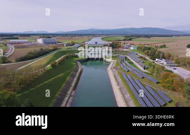 Aerial view of a hydroelectric power plant showing water intake and ...