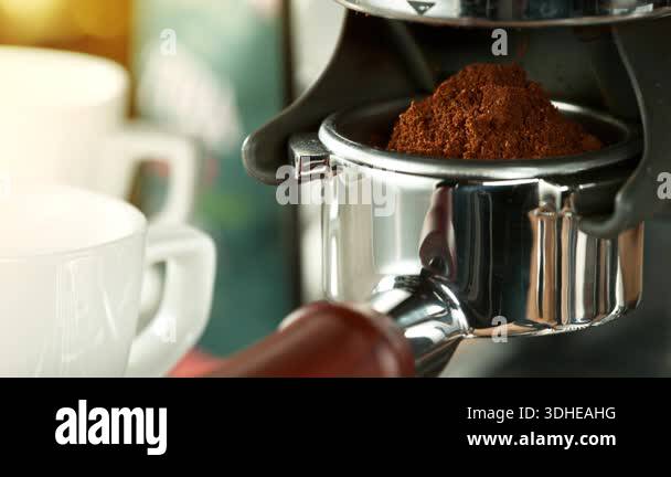 Close-up Slow Motion of Grounding Coffee from Coffee Machine . Filmed ...