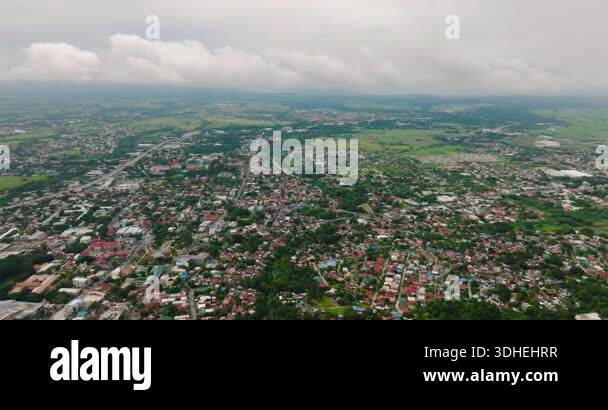 Drone view of Iloilo City with houses and colonial churches. Panay ...