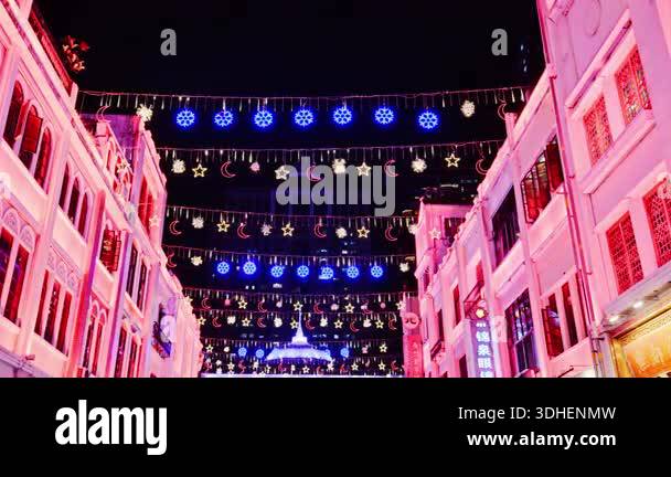 blurred bokeh string of lights between buildings in guangzhou, china ...