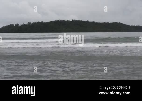 Waves Moving on the Sea with a Mountain Landscape a Cloudy weather on a ...