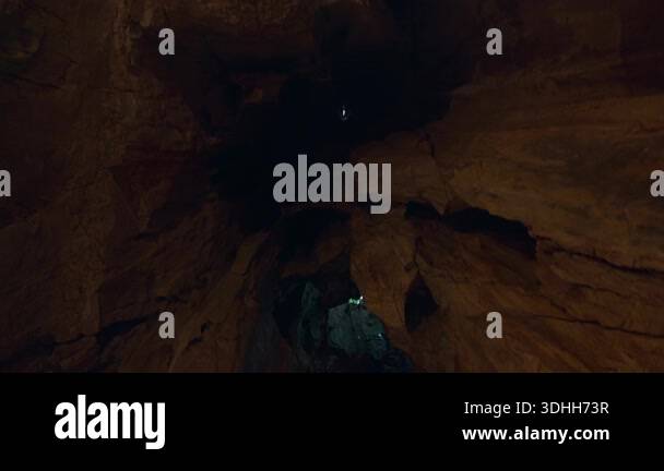 Bright Natural Opening at Top of Dark Cave Illuminating Rough Rock ...