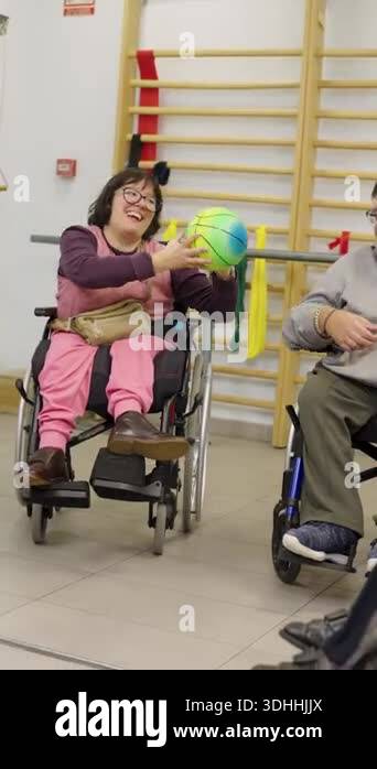 Group of smiling people with disabilities in wheelchairs having fun ...