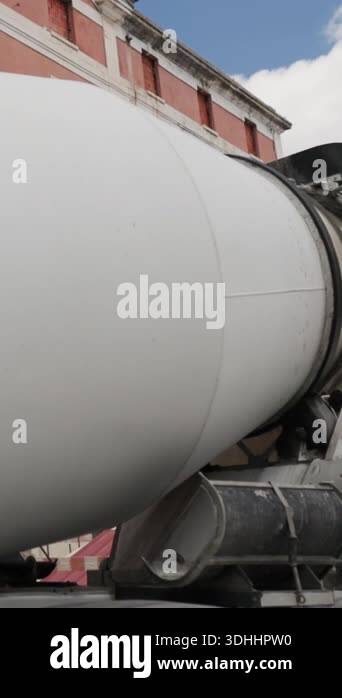 Rotating drum of cement mixer truck during concrete preparation Stock ...