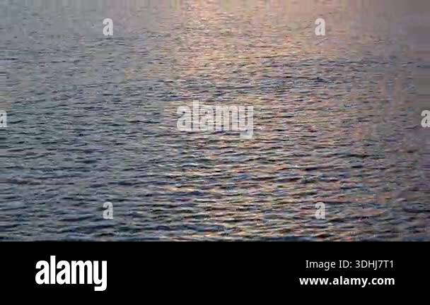 A zoom-out shot transitions from the textured ripples of the sea ...