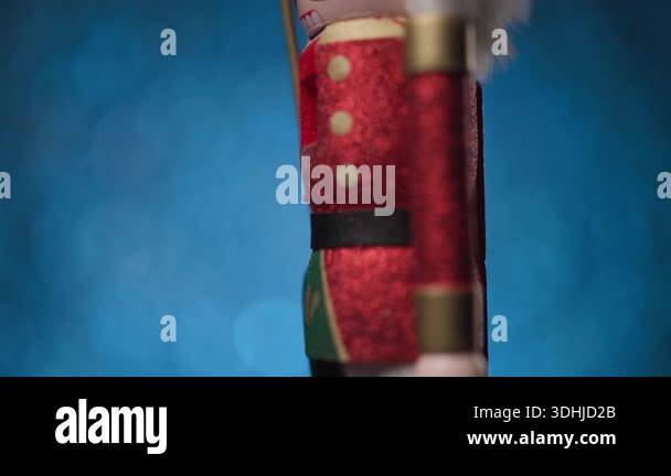 Dynamic motion of the Toy Nutcracker against a lively blue bokeh ...