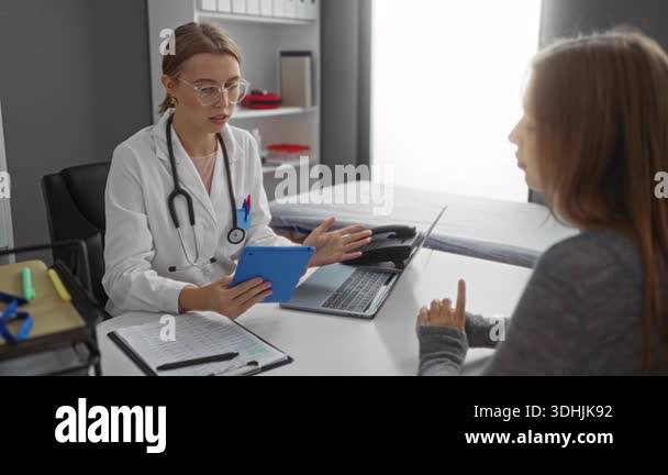 Doctor consulting patient in clinic room with tablet, surrounded by ...