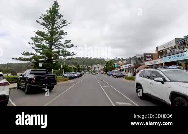 A drive along Lorne's main street captures vibrant shops, parked cars ...