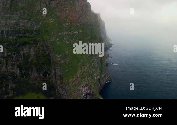 Misty Cliff Overlooking Ocean Horizon, Cloudy Precipice With Lush ...