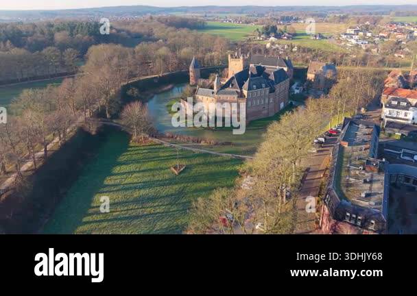 Aerial view of Dutch town red brick castle with moat, church spire ...