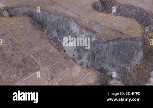 Agricultural terraces hugging rugged canyon walls, expansive Andean ...