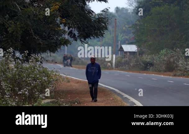 Dibrugarh, Assam, India 10 January 2026: A man walks along the side of ...