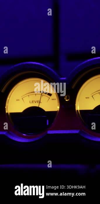 Close-up of two analog VU meters measuring audio signals on ...