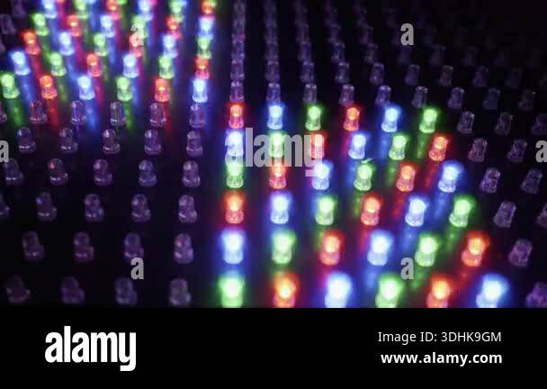 Close-up of a grid of RGB LED lights flashing in dynamic patterns ...