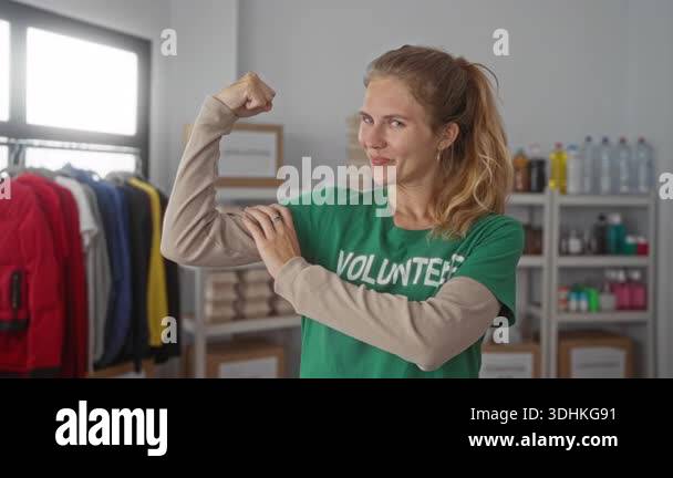 Woman arm flexing charity blonde young volunteer donation smile ...