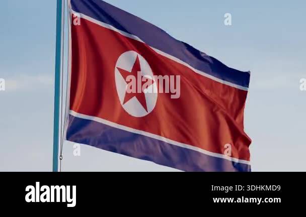 North Korea, Pyongyang: Cinematic Waving National Flag Against Blue Sky ...