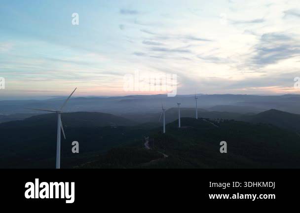 Aerial perspective of a wind farm on a mountain ridge. Wind turbines ...