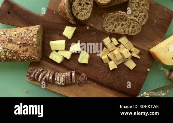 Slices of bread cheese and salami arranged Stock Video Footage - Alamy