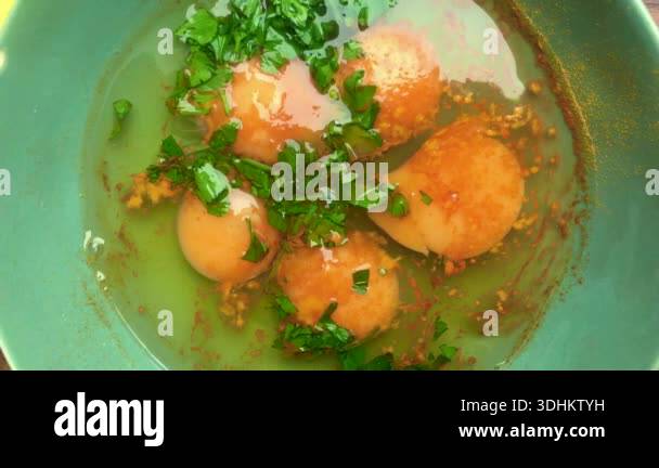 Boiled eggs garnished with fresh herbs Stock Video Footage - Alamy