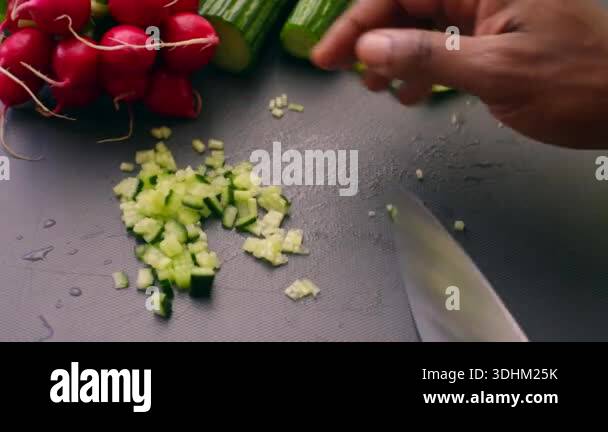 Closeup of person hands chopping cucumber for vegan lunch Stock Video ...