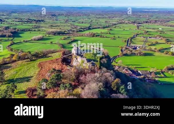 A rotating aerial view of Beeston castle and surrounding countryside ...
