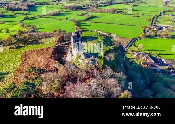A close in receding aerial view of Beeston castle near Chirk, Wales ...