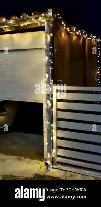 Decorative lights illuminating modern entrance Stock Video Footage - Alamy