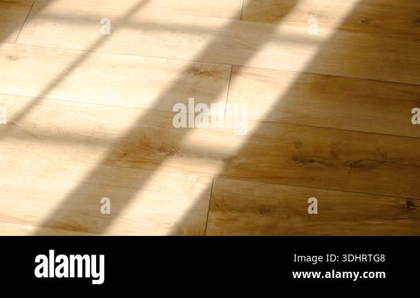 Sunlight stripes cast on warm wooden floorboards surface texture ...